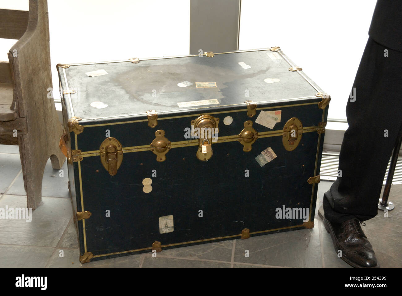 Old trunk with travel stickers Stock Photo - Alamy