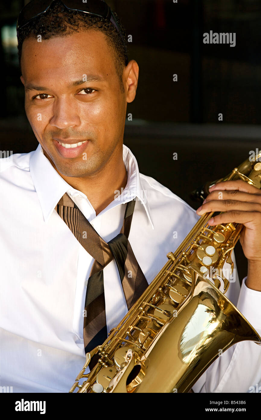 A young and trendy Black British saxophone musician Stock Photo - Alamy