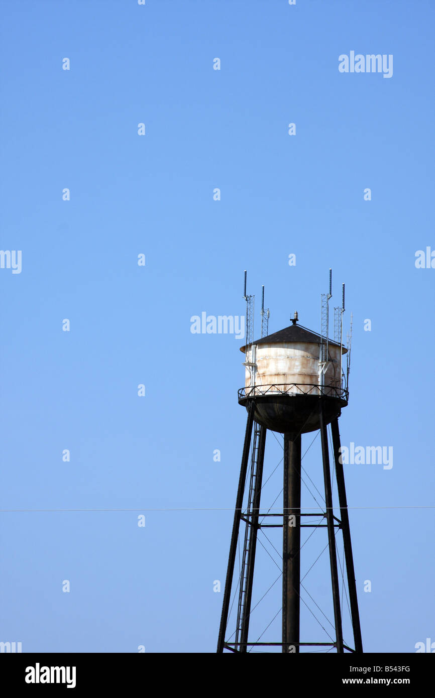 A water tower with antennas on the top of it Stock Photo - Alamy