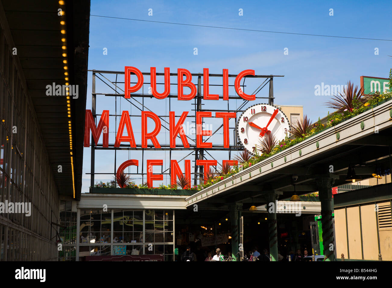 Clock and sign at Pike Place Public Market Center in downtown Seattle ...