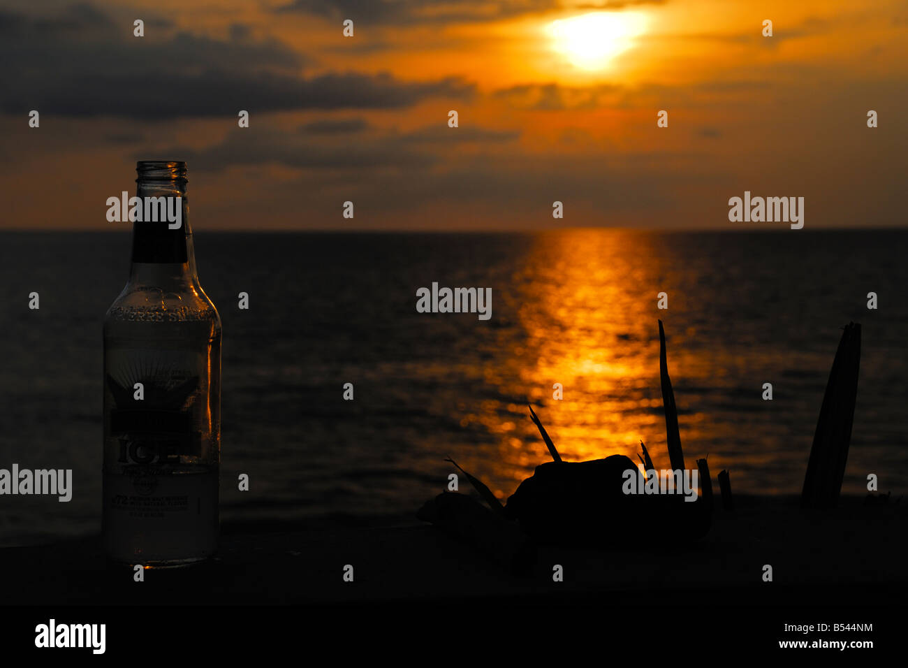 Relaxing and enjoying a drink during a beautiful evening and sunset at ...