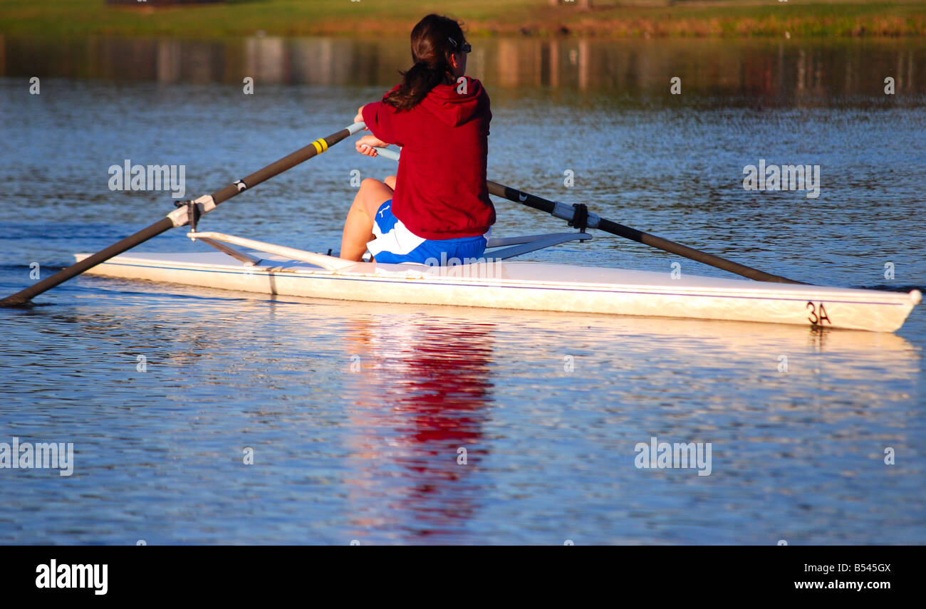 Woman rowing a boat for her college team Stock Photo - Alamy