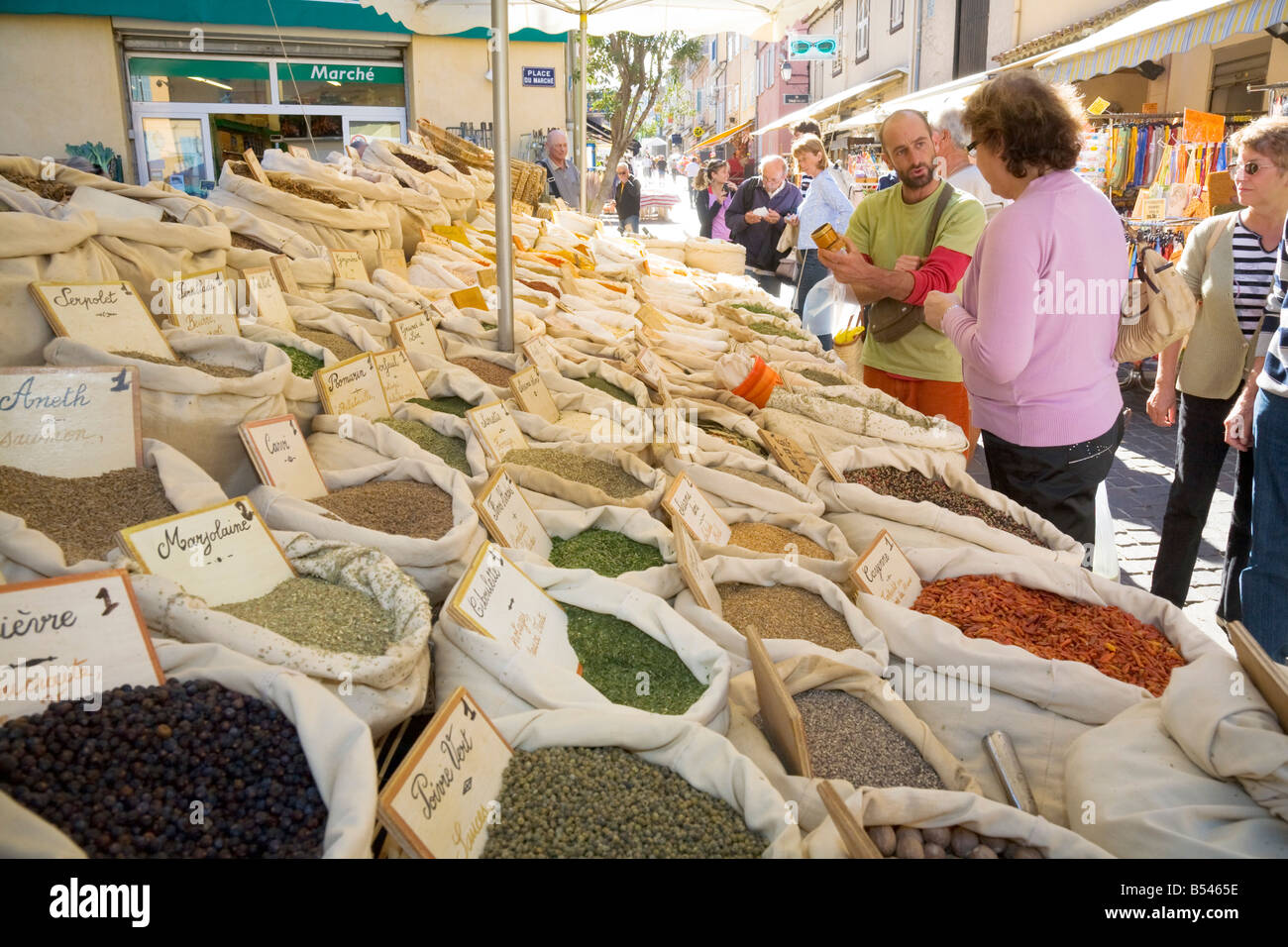 A variety of herbs and spices is being offered at a farmers market in ...