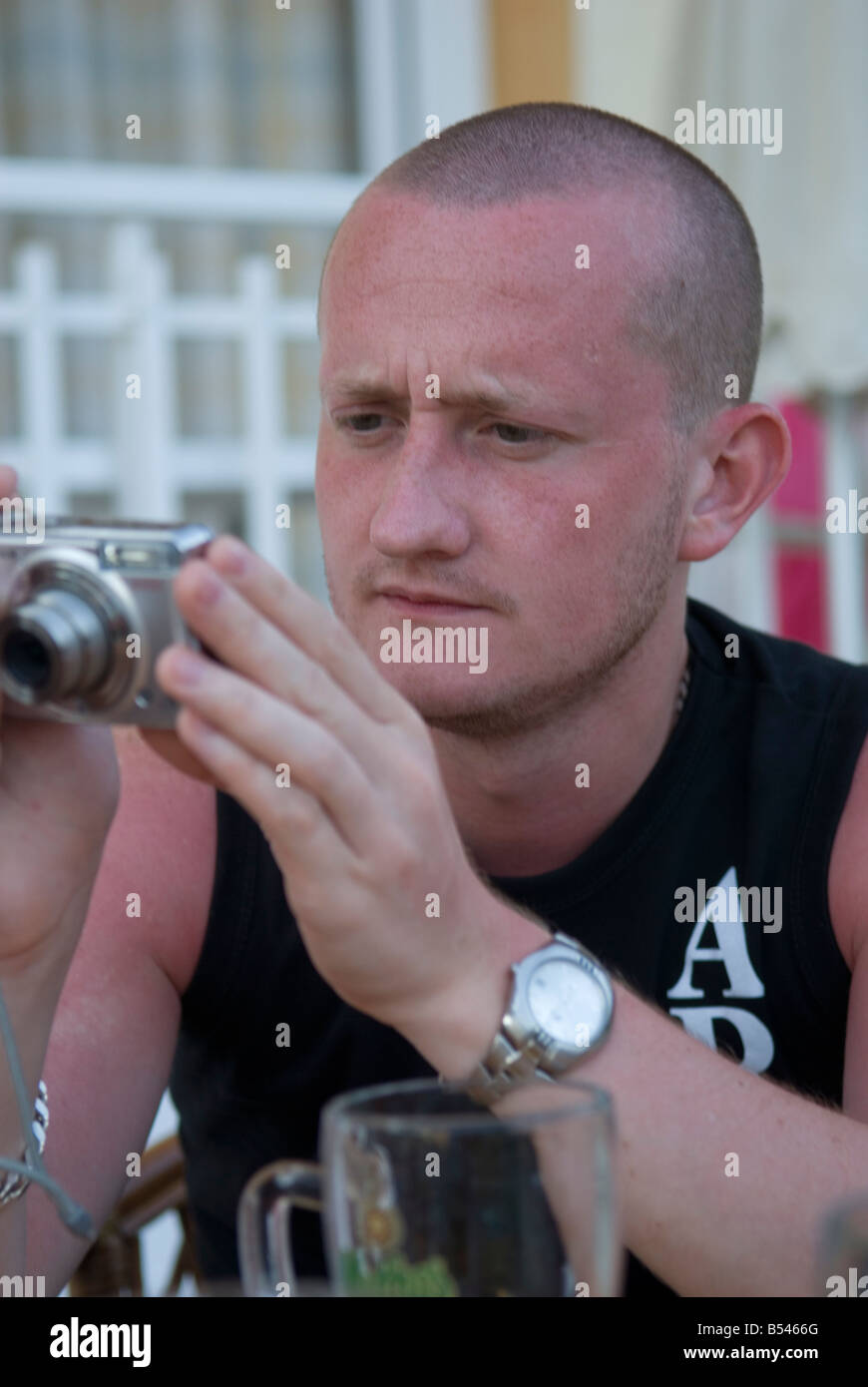 Man using digital compact camera Stock Photo - Alamy