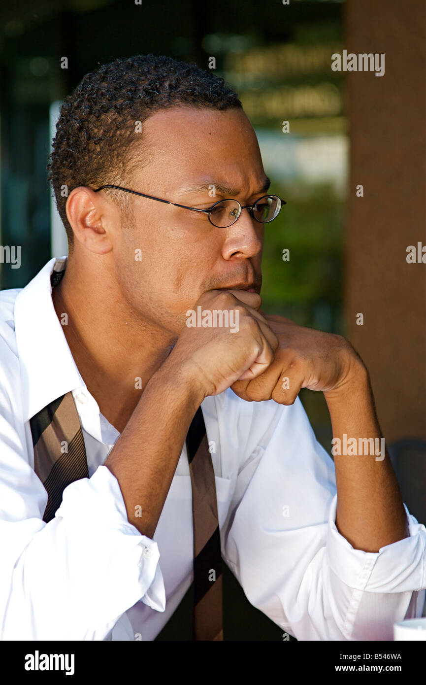 An confident and successful African American businessman in a power ...