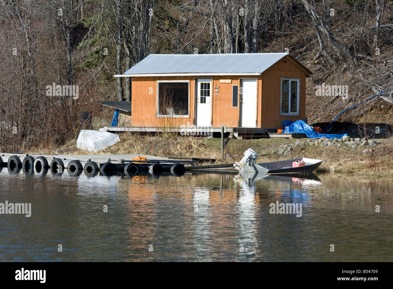Dock shed on small lake Stock Photo - Alamy