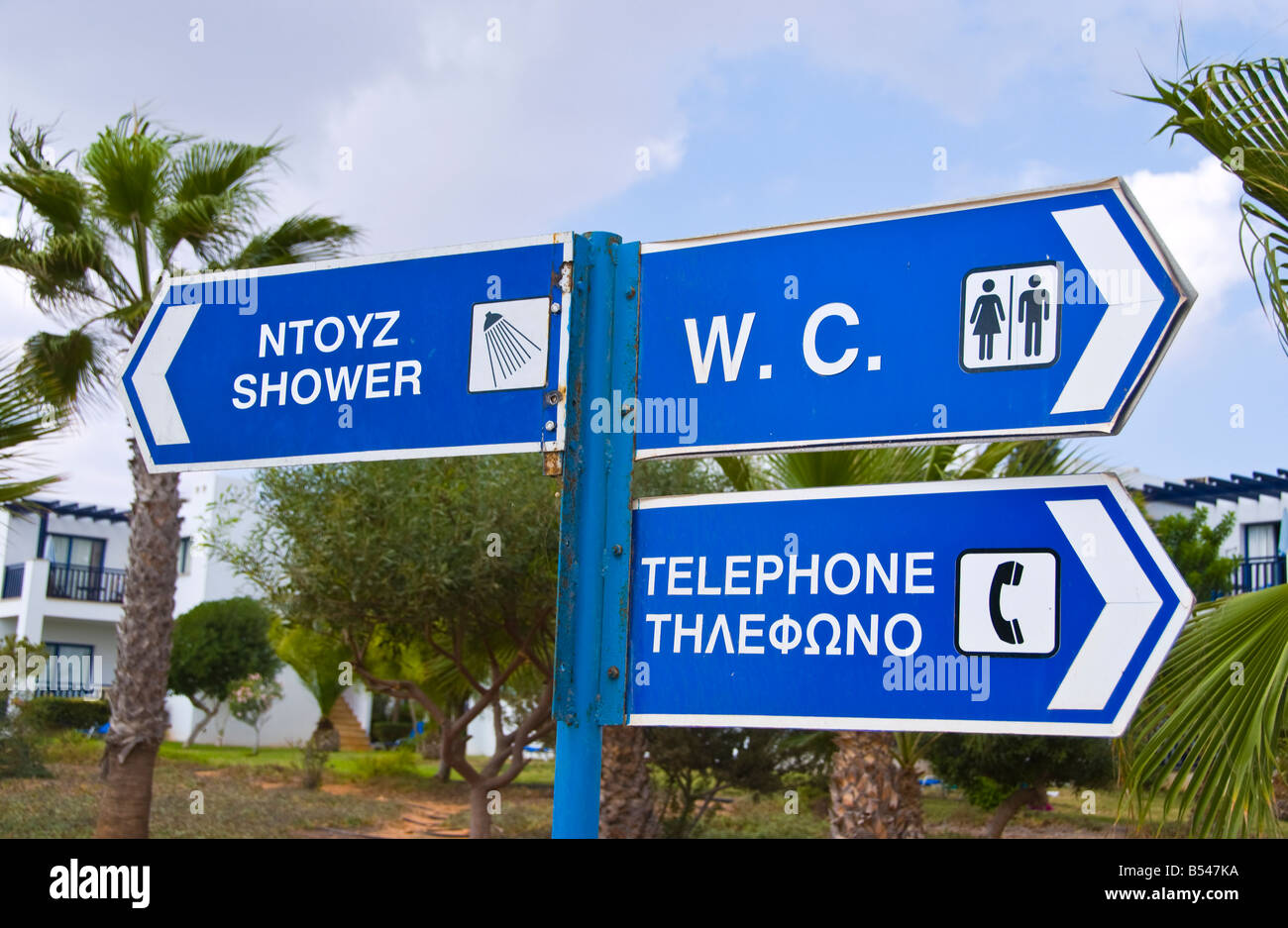 Bilingual direction sign to toilet shower and telephone on beach near ...