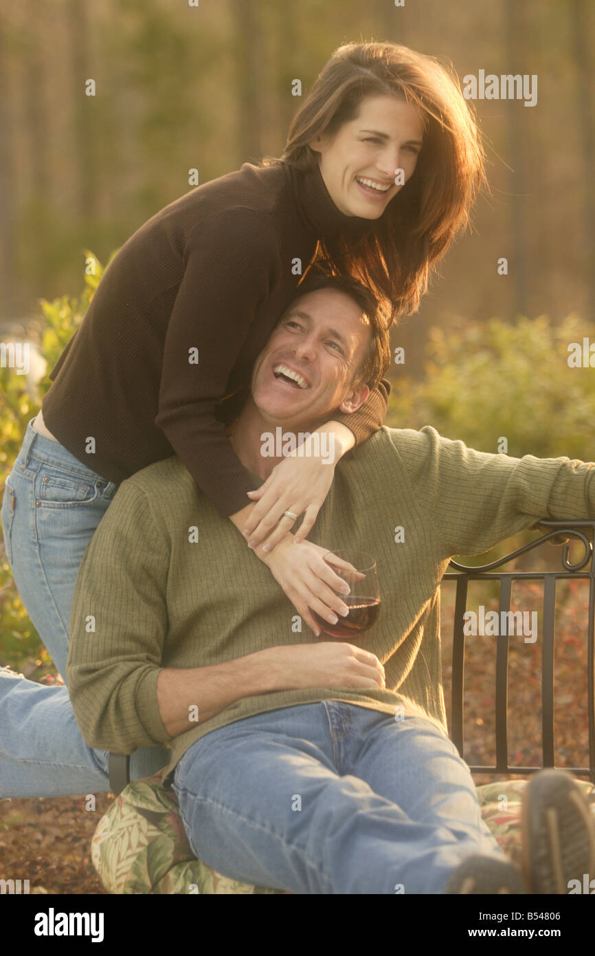 Couple laughing outside Stock Photo - Alamy