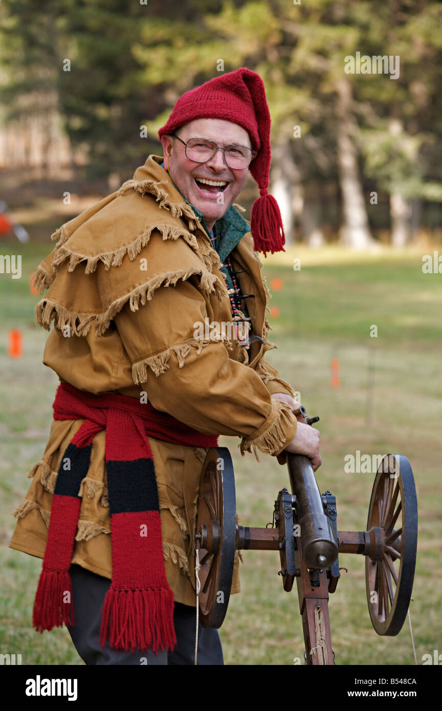 Man wearing trapper costume demonstrating black powder cannon at Steam ...