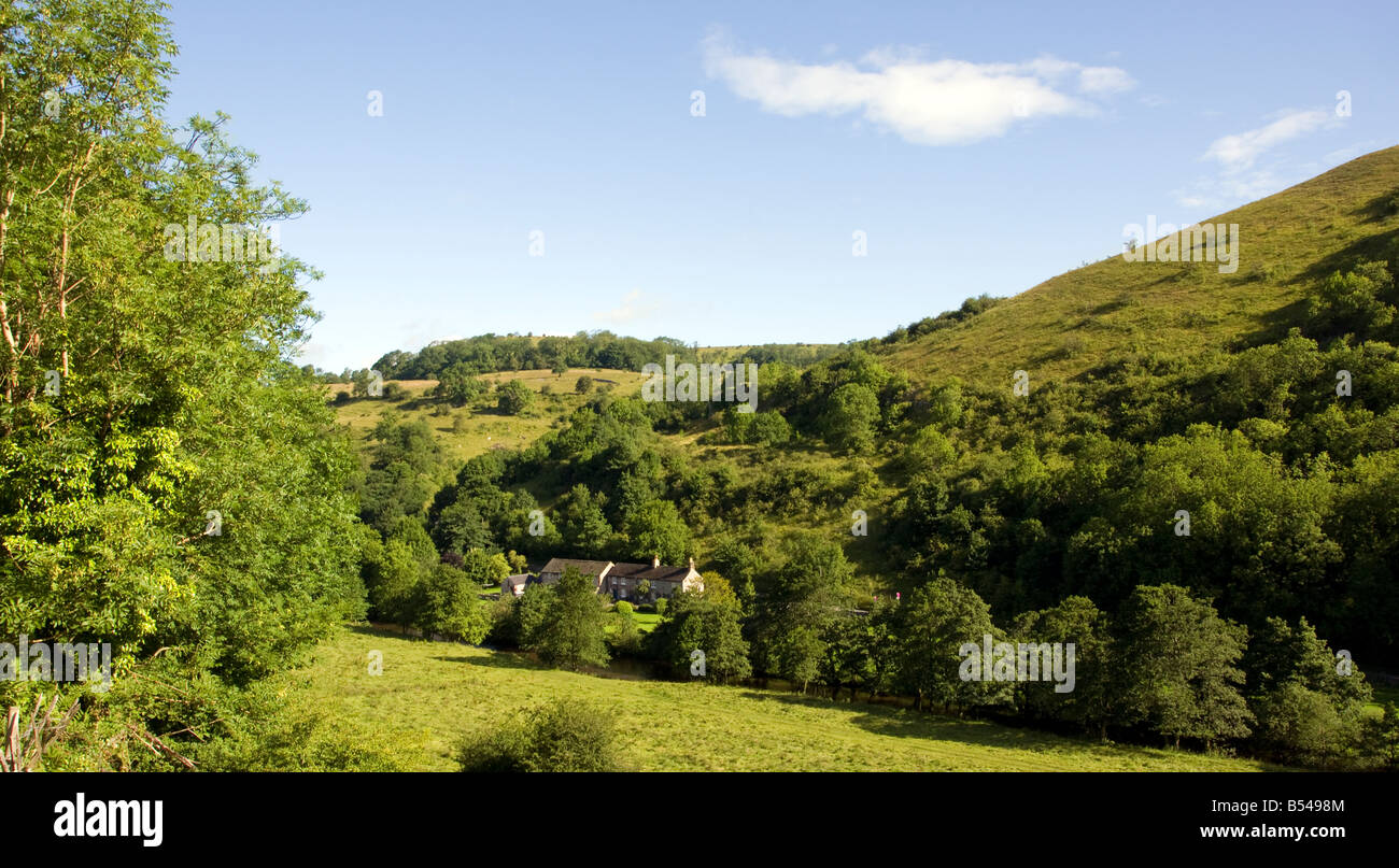 farmhouse in monsal dale valley viewed from the viaduct in the summer ...