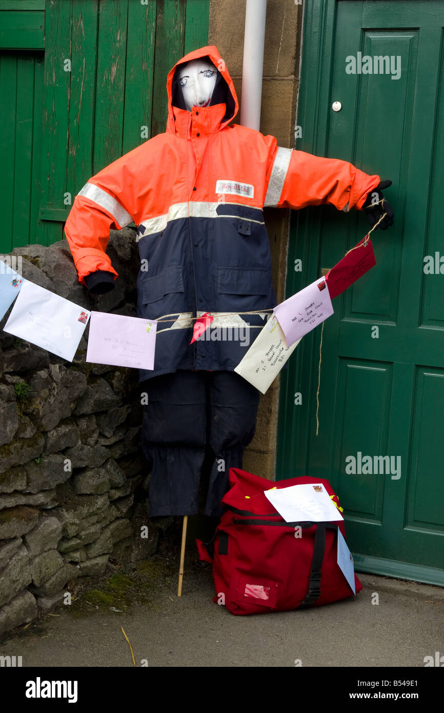 english postman royal mail chain letter scarecrow Stock Photo - Alamy