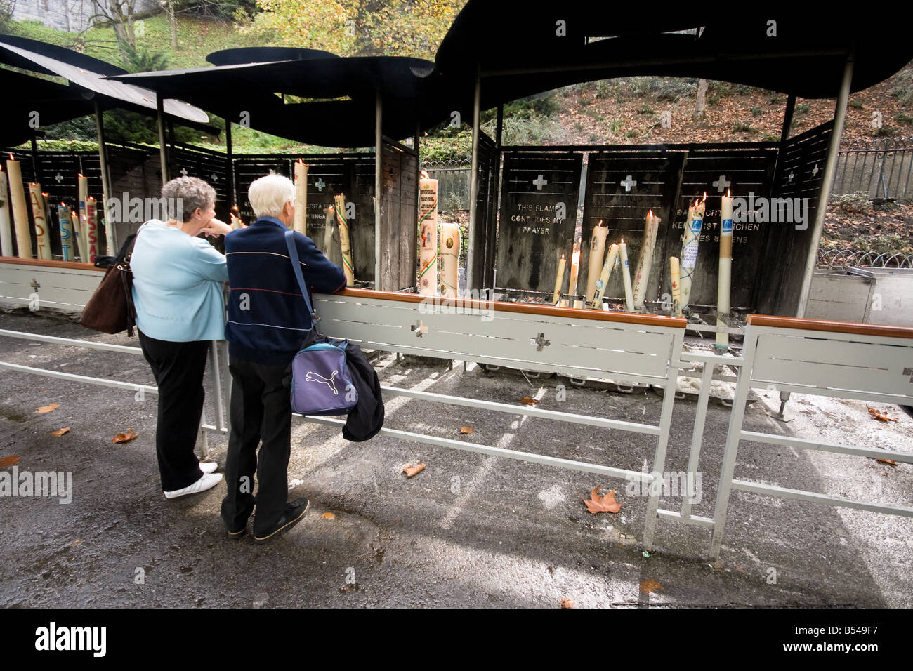 Woman praying candles hi-res stock photography and images - Alamy