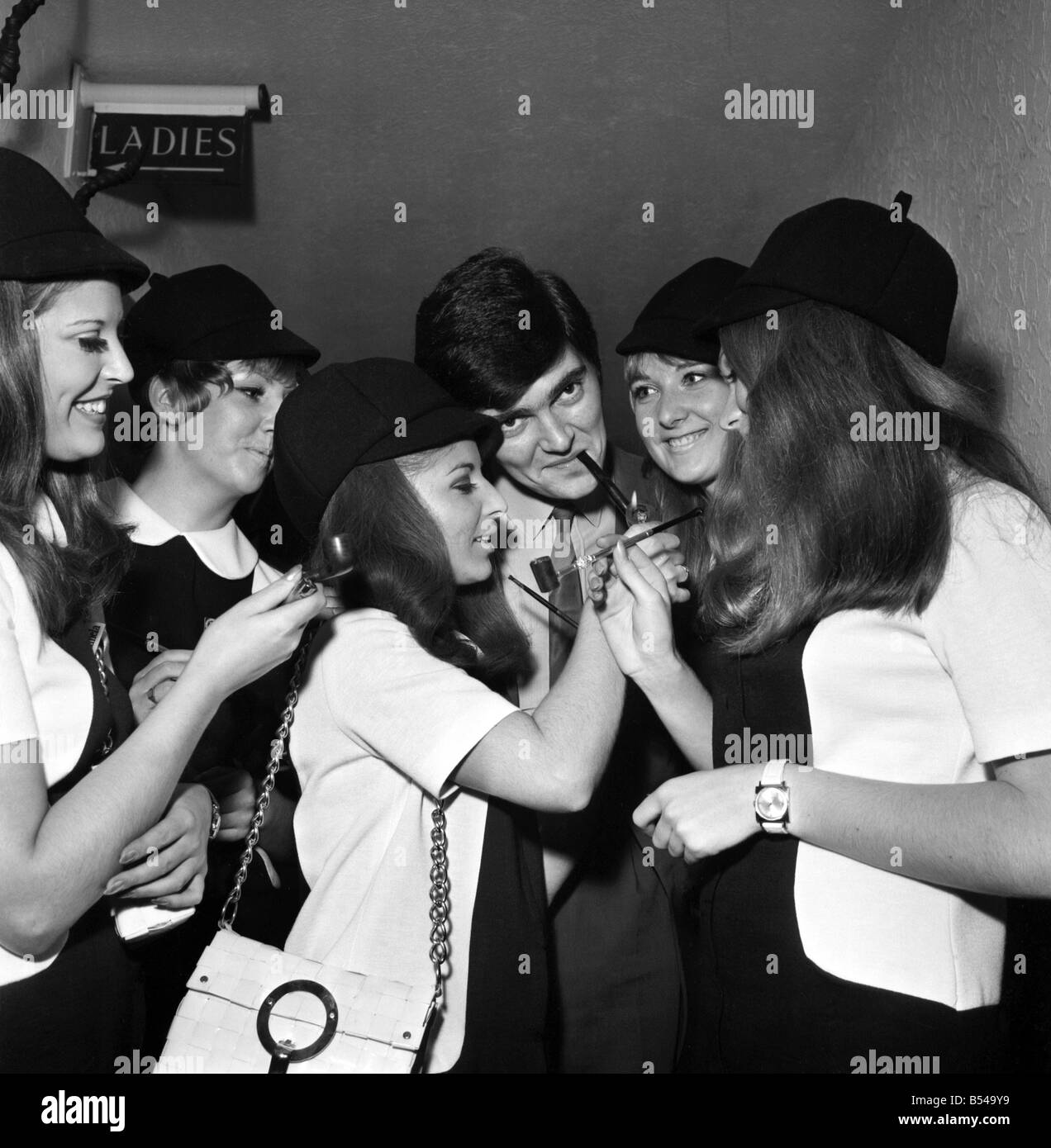 A group of fire women smoking pipes down the local pub. November 1969 ...