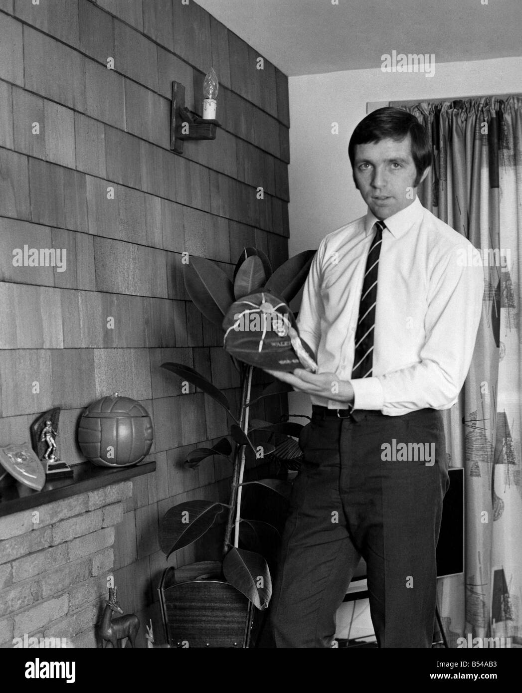 Jeff Astle pictured at home, with some of his trophies and one of his ...