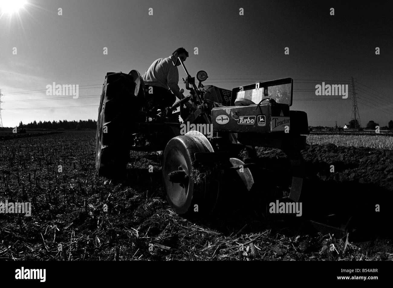 Tractor plowing farm field Black and White Stock Photos & Images - Alamy
