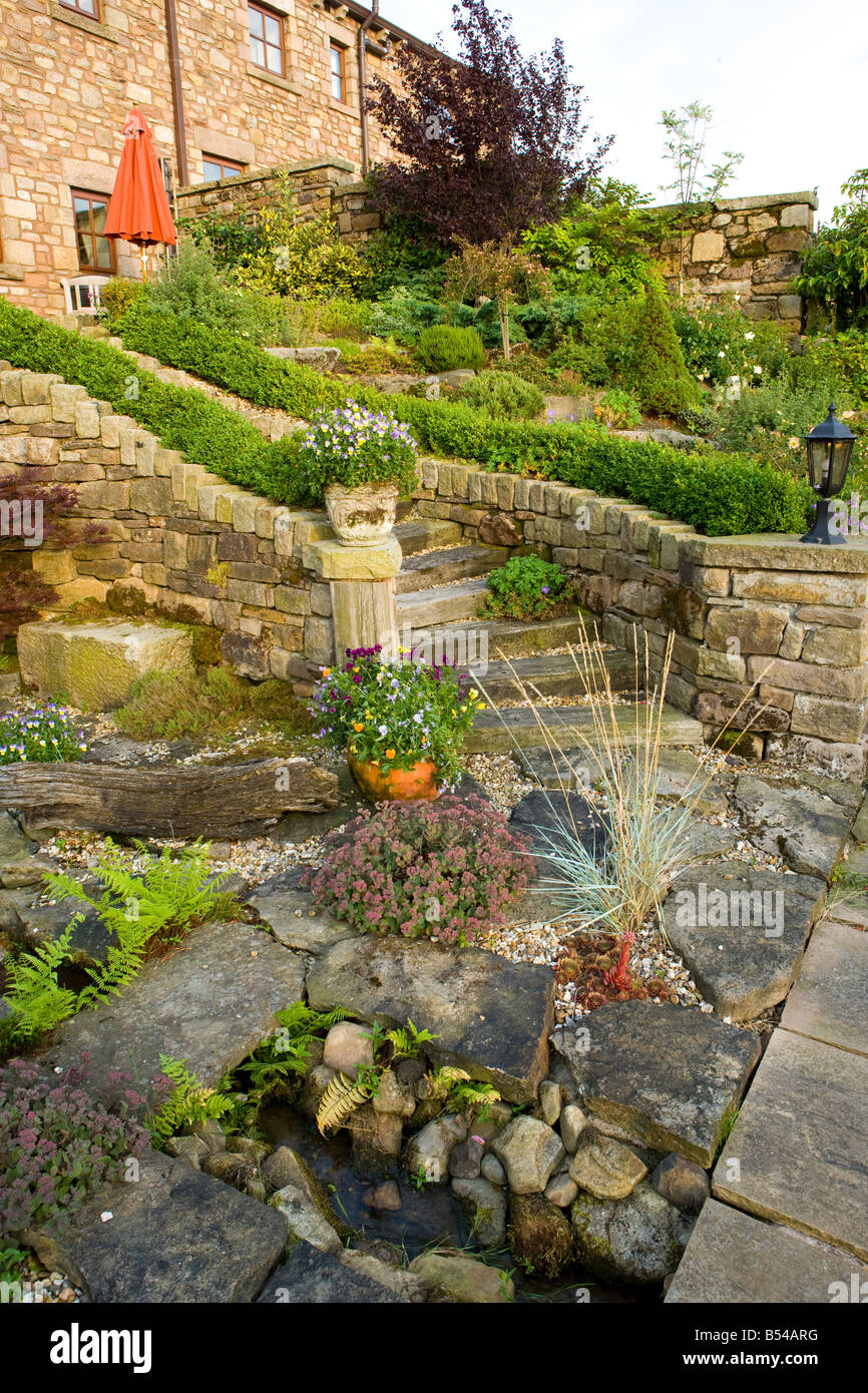 rockery and water feature Stock Photo - Alamy