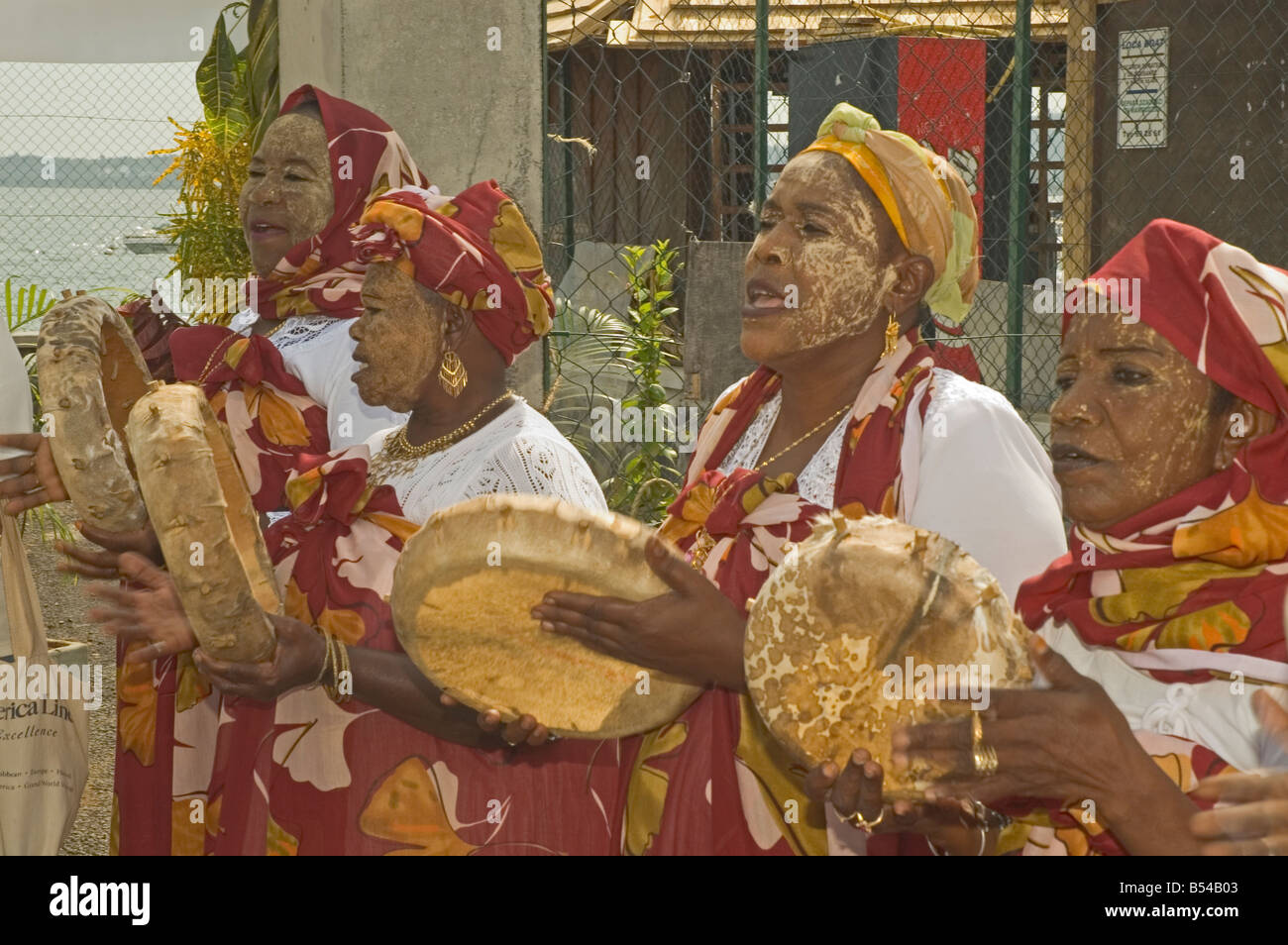 INDIAN OCEAN MAYOTTE Mamoudzah women singers playing tambourines and ...