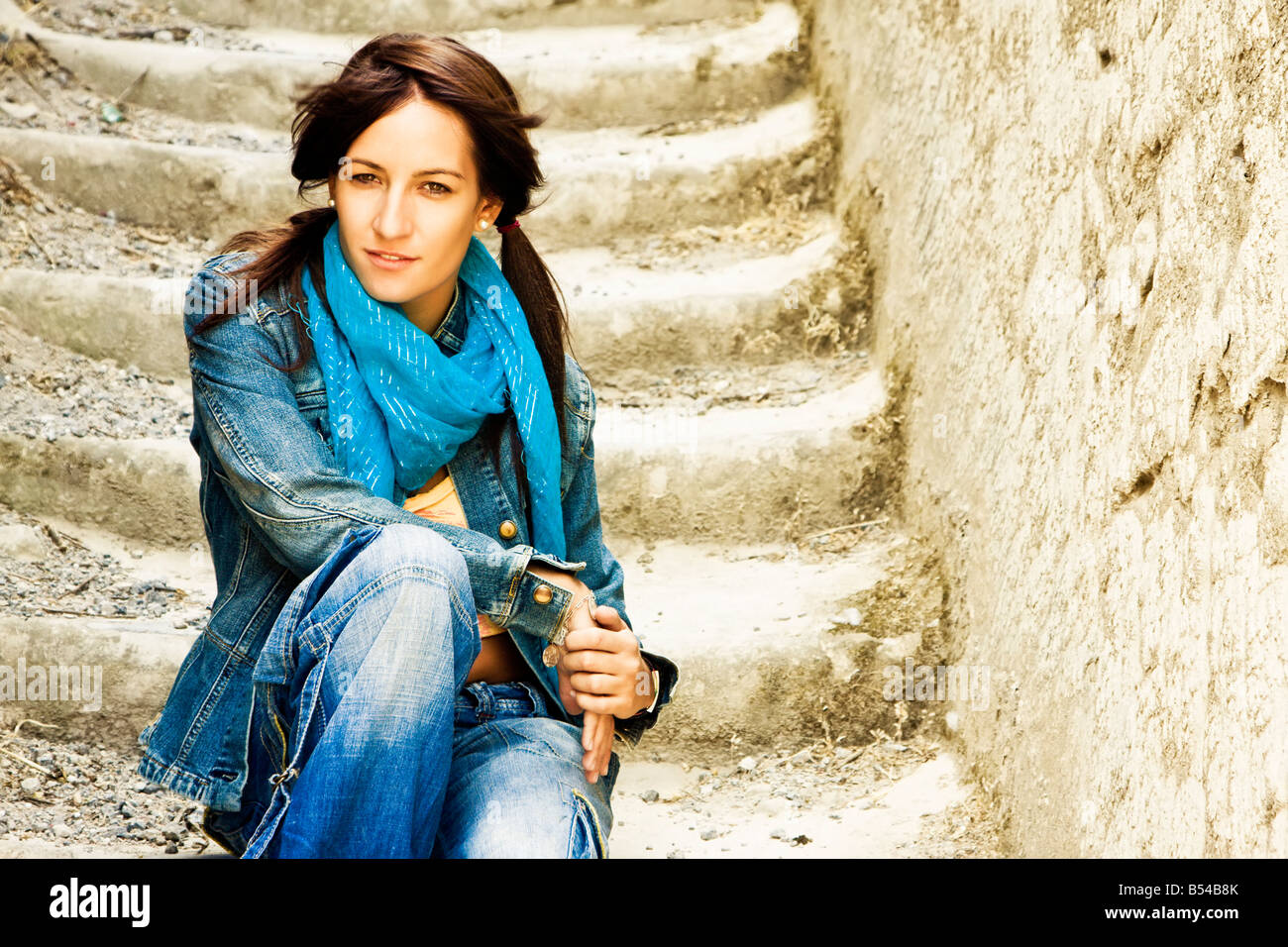 Young staring woman sitting on stone stairs Stock Photo - Alamy Young staring woman sitting on stone stairs Stock Photo - Alamy