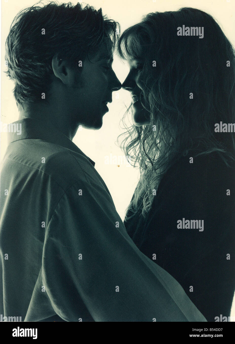 A couple enjoy a romantic cuddle Stock Photo - Alamy