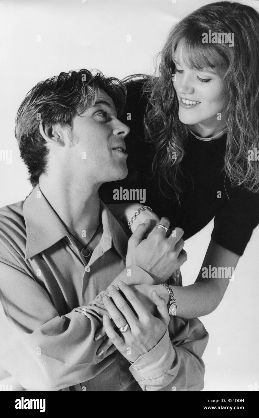 A couple enjoy a romantic cuddle Stock Photo - Alamy