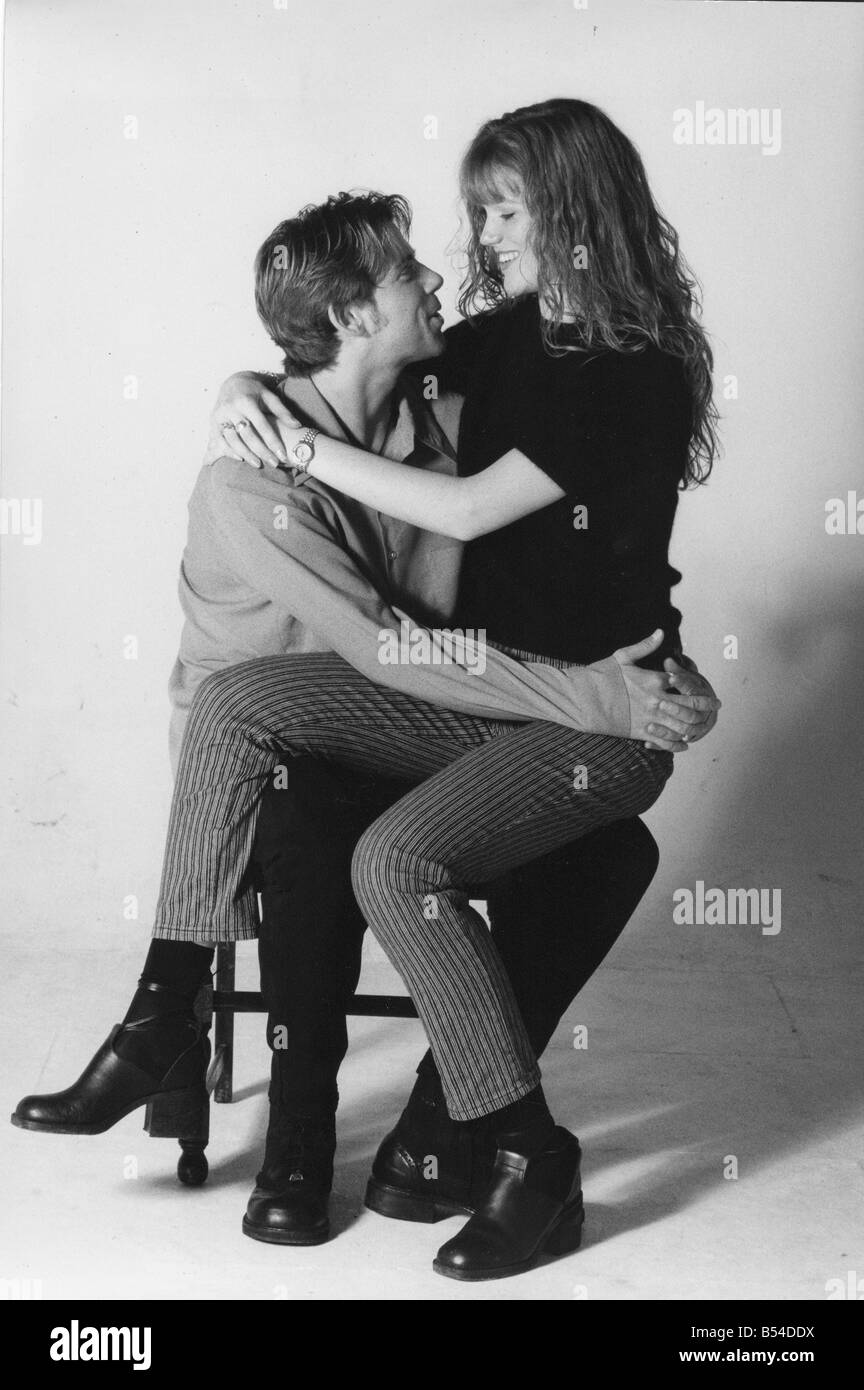 A couple enjoy a romantic cuddle Stock Photo - Alamy