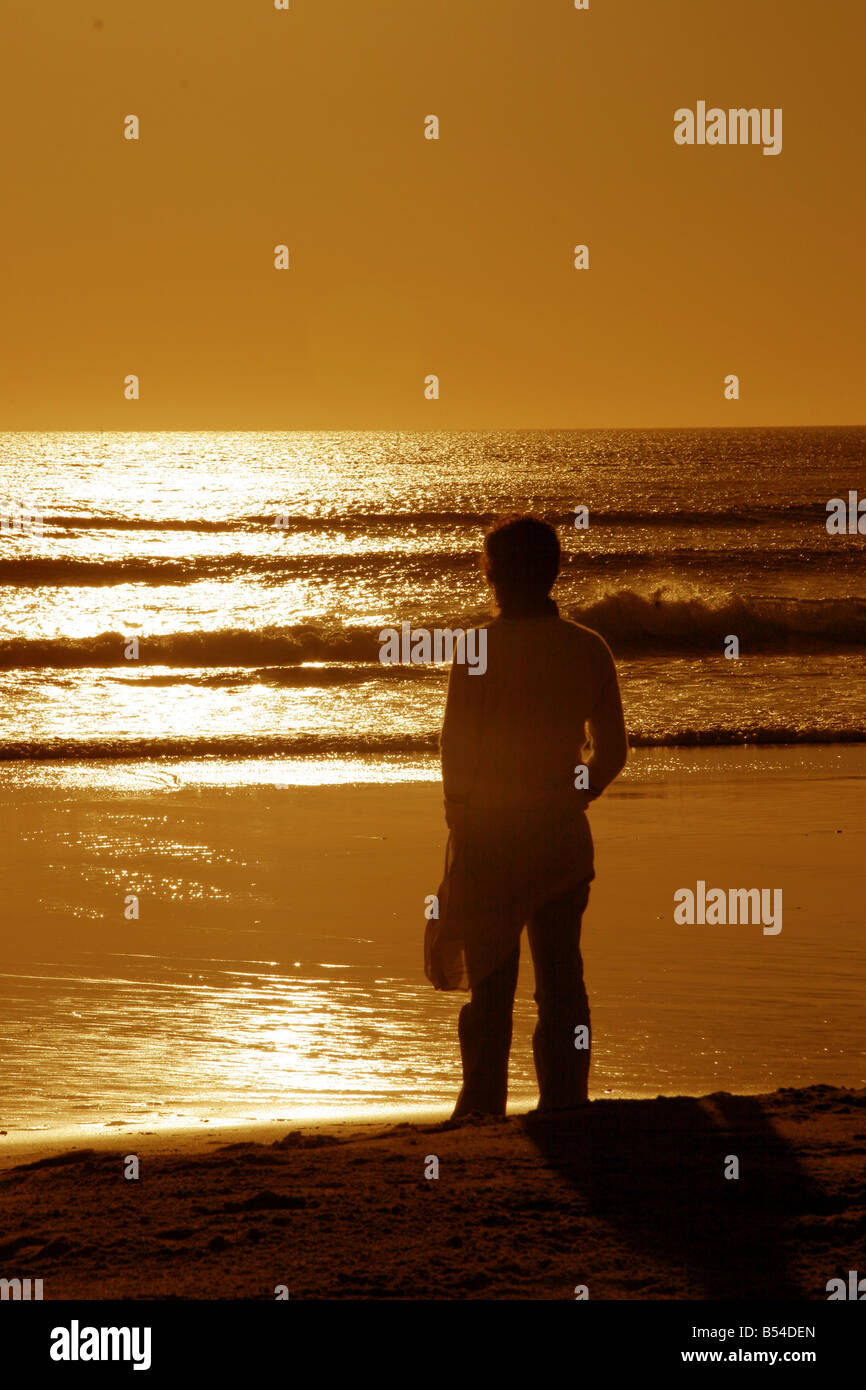 Person standing on beach hi-res stock photography and images - Alamy