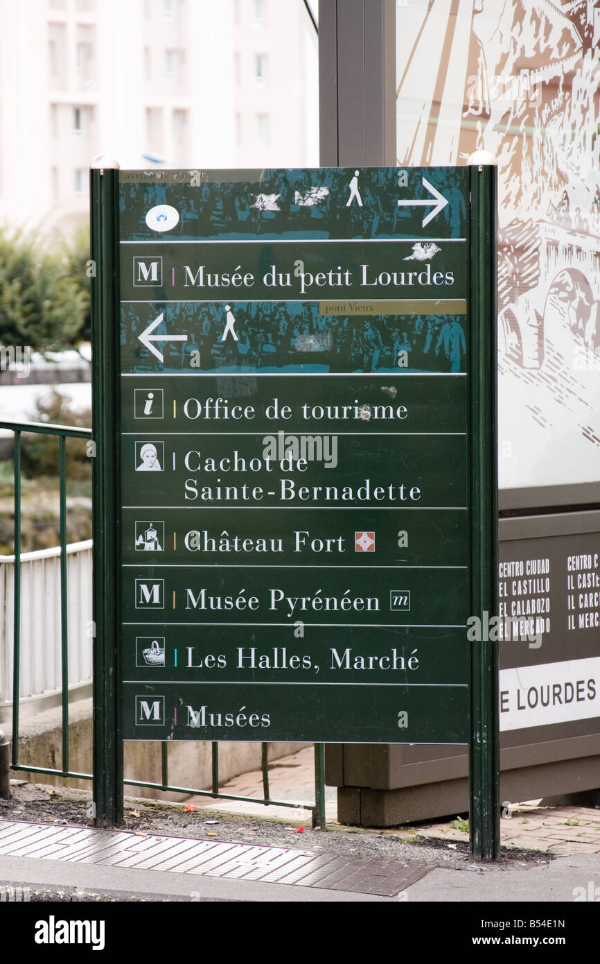 Directions sign around Lourdes, Southern France Stock Photo - Alamy