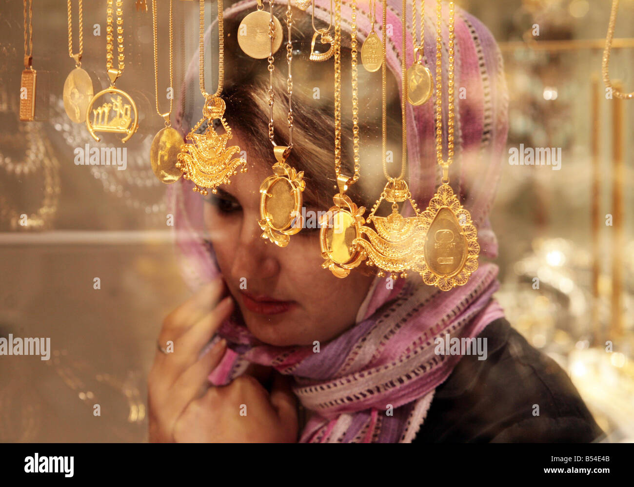 a woman shopping for gold in tehran market Local Caption Iran Stock ...