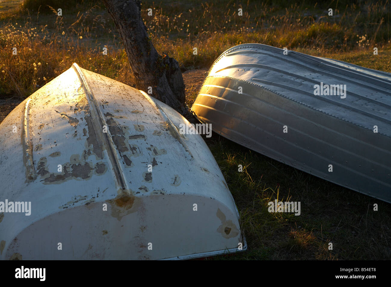 two metal row boats at dusk Stock Photo - Alamy