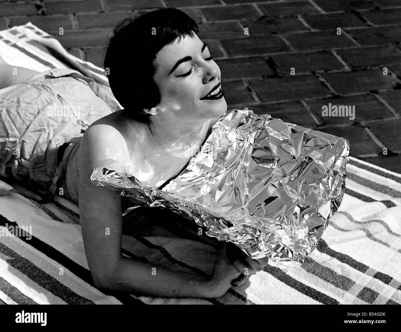 Humour sunbathing Black and White Stock Photos & Images - Alamy