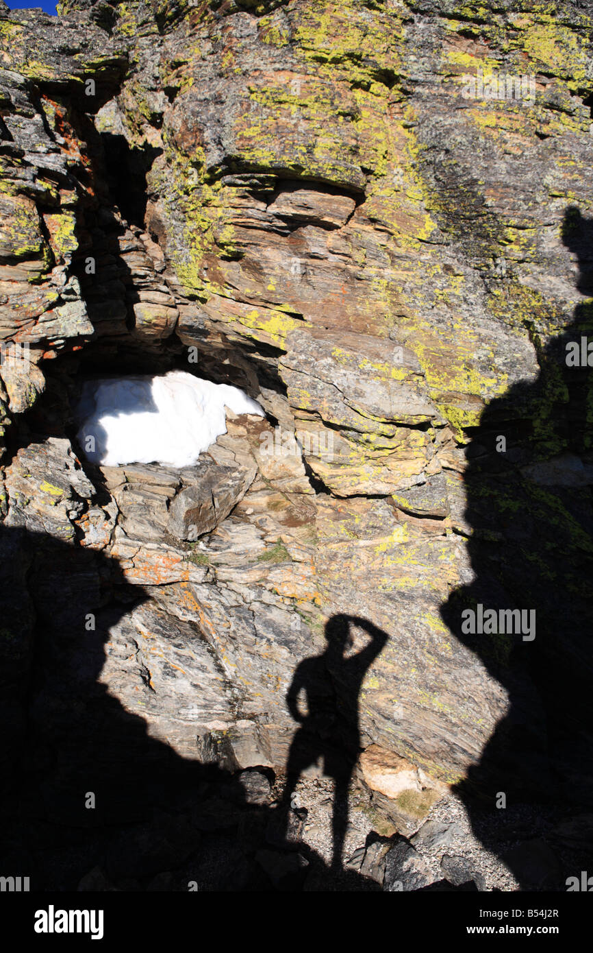Hiker's shadow on rock formations, Rocky Mountains National Park ...