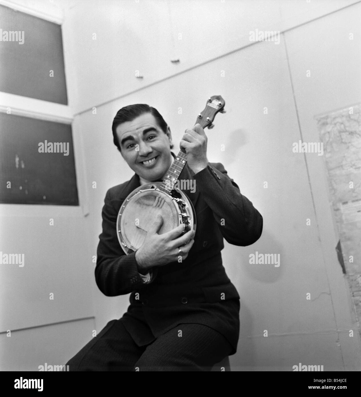 Man wearing a suit playing the Banjo. October 1969 Z10485-002 Stock ...