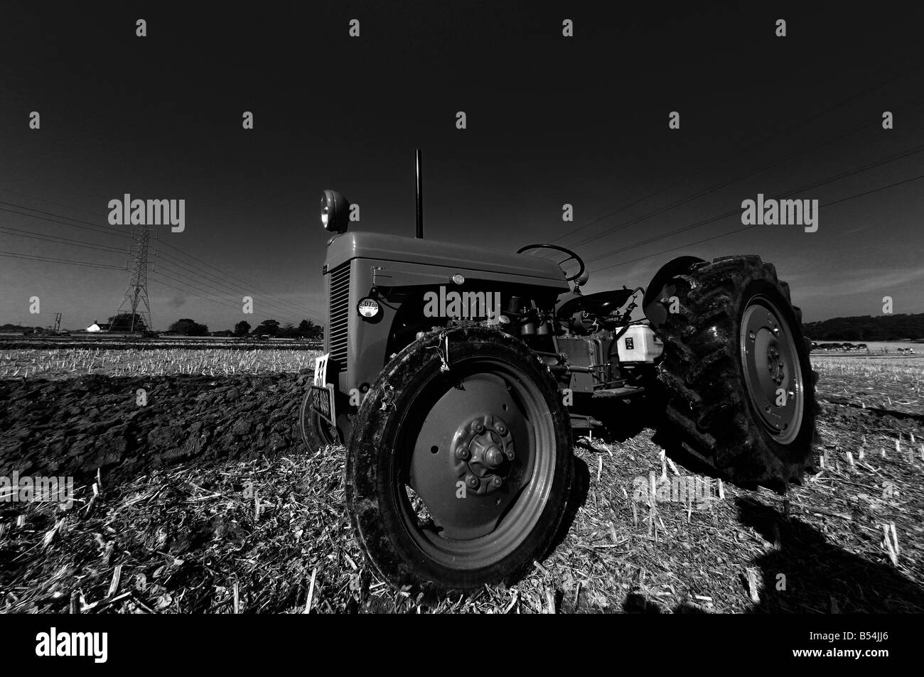 Tractor plowing farm field Black and White Stock Photos & Images - Alamy