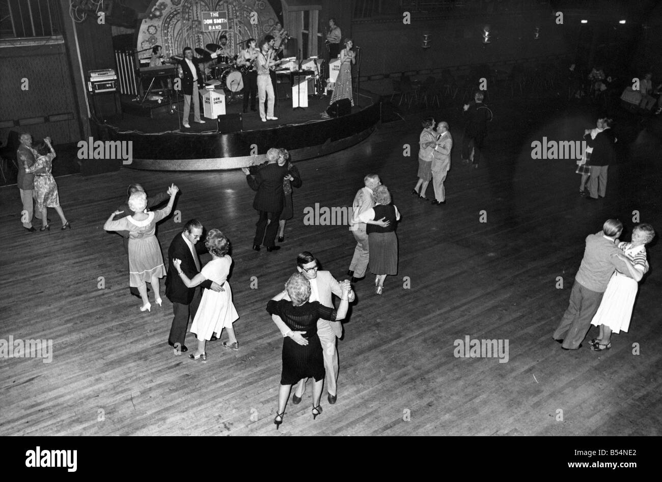 Couples enjoying a spin round the floor ballroom dancing Stock Photo ...