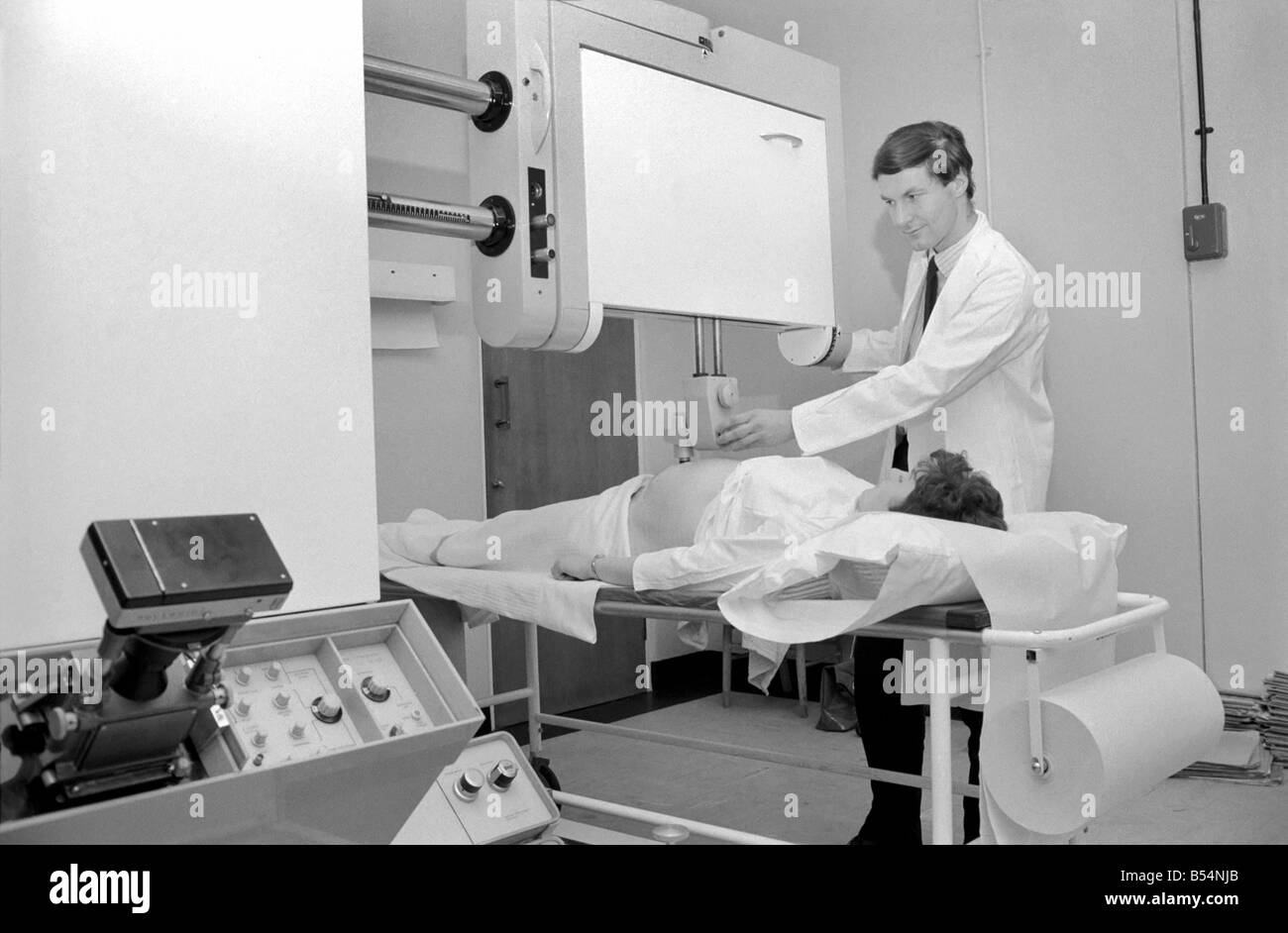 Medical Pregnancy Equipment. Dr. Stewart Campbell using the ultra-sonic ...