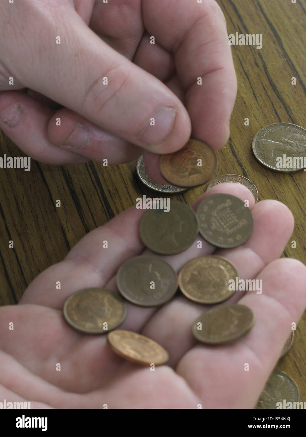 man counting the pennies Stock Photo - Alamy