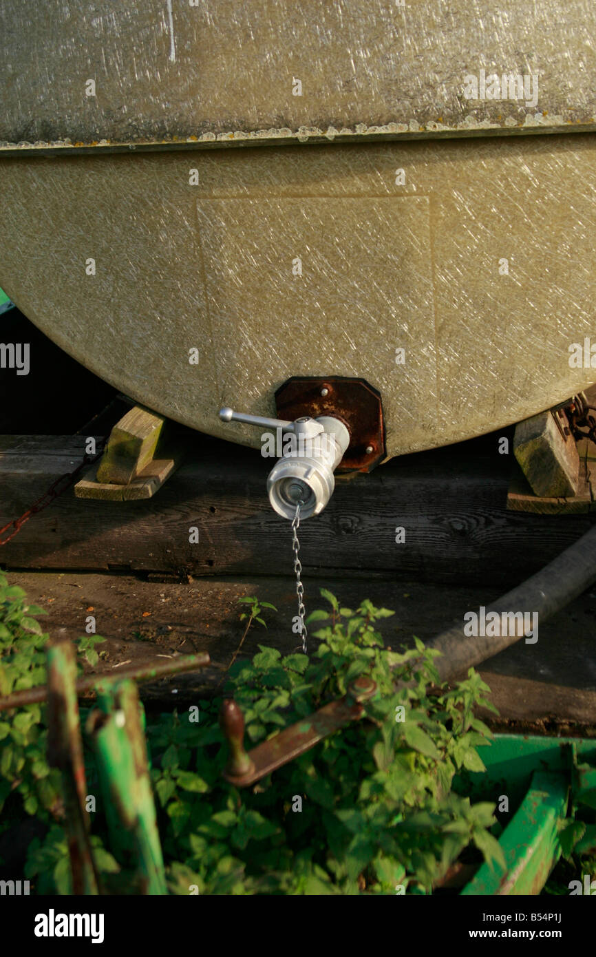 overgrown water tank Stock Photo - Alamy