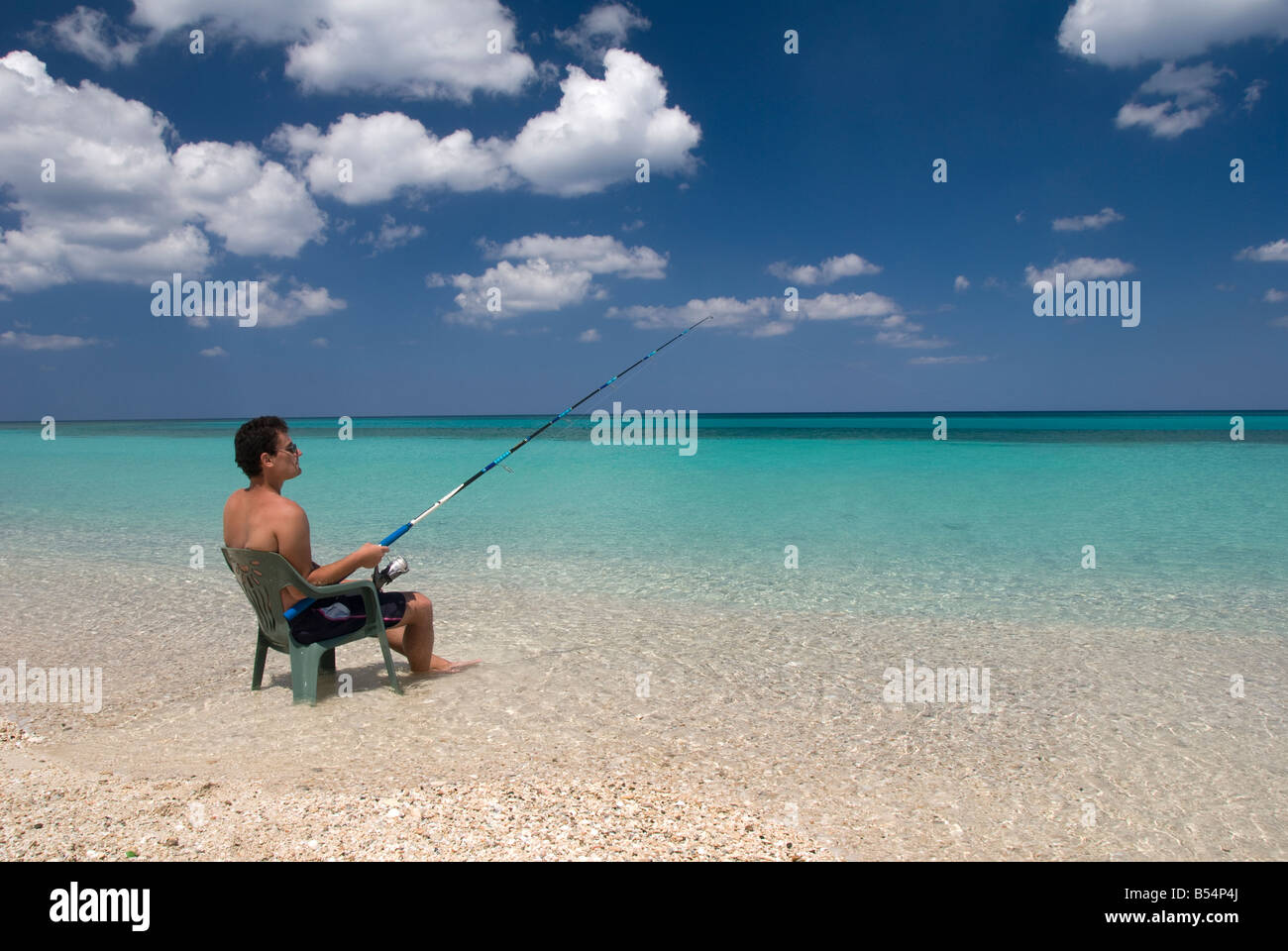 Seated Man Fishing High Resolution Stock Photography and Images - Alamy