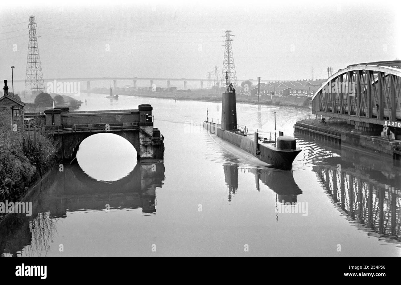 H.M.S Onyx leading H.M.S Olympus through the Barton Bridge area of the ...