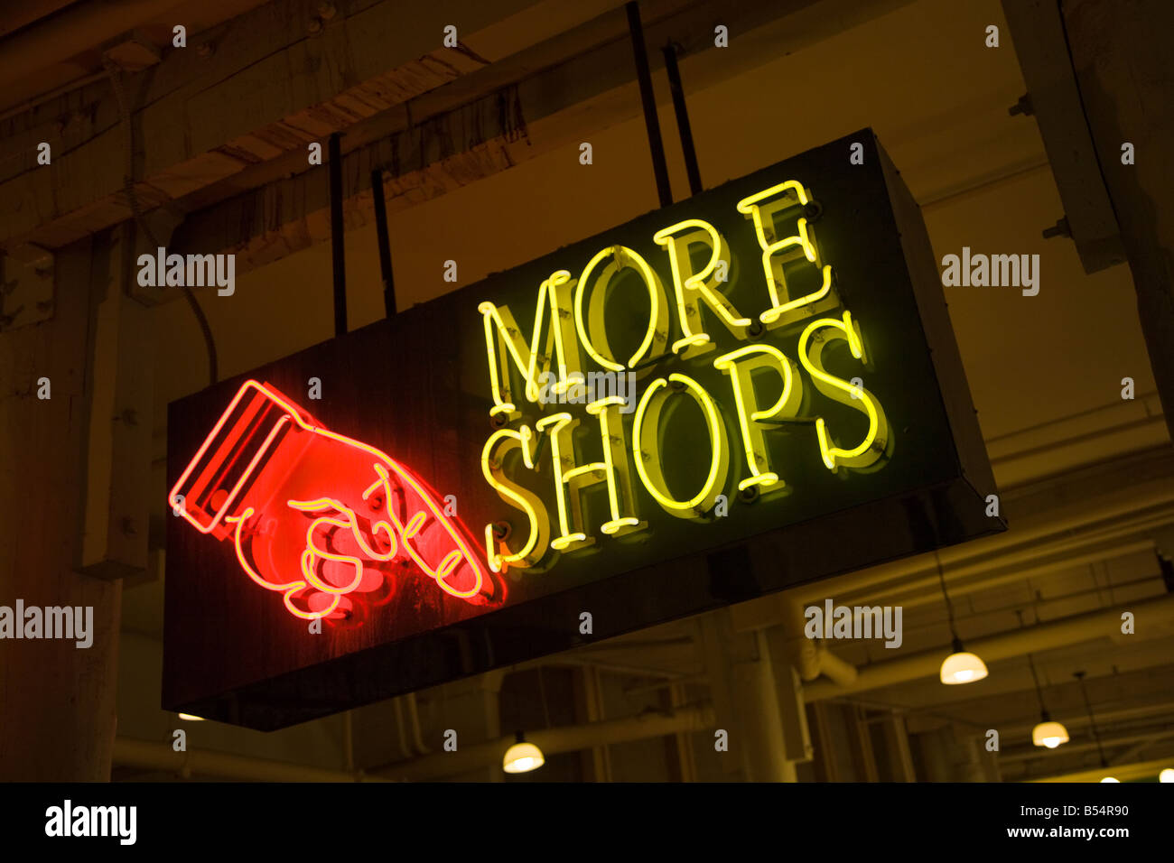Neon sign hand pointing to More Shops downstairs at Pike Place Market ...