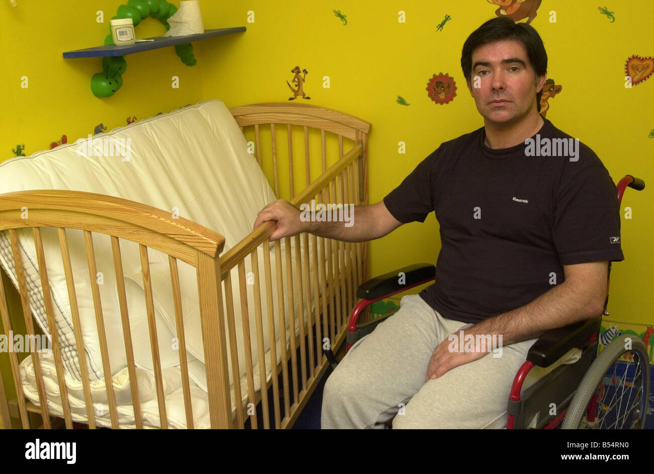 Heartbroken Eddie Kidd Jan 2002 by his baby son Callums empty cot Stock ...