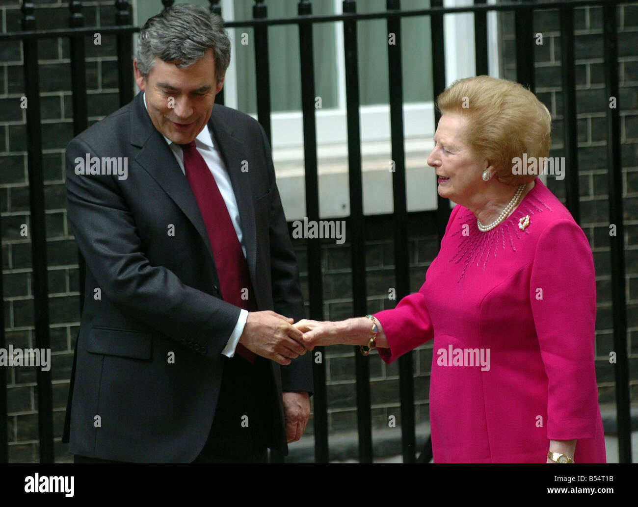 Former Premier Margret Thatcher is greeted by current Prime Minister ...