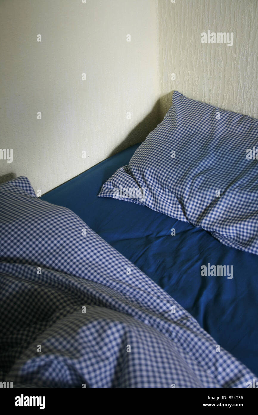 one empty bed matress in dark bedroom Stock Photo - Alamy