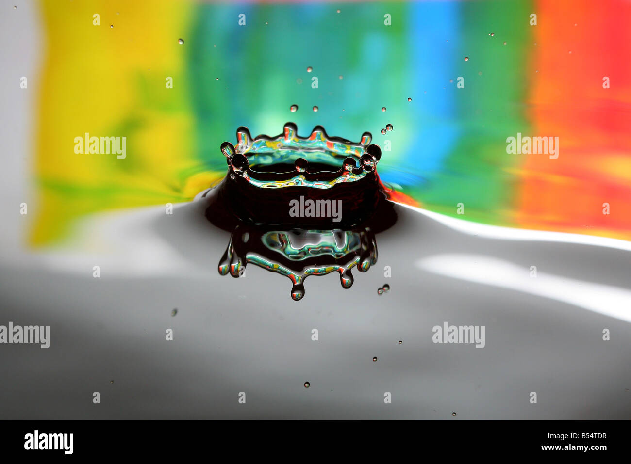 A slash of water on a colorful background Stock Photo - Alamy
