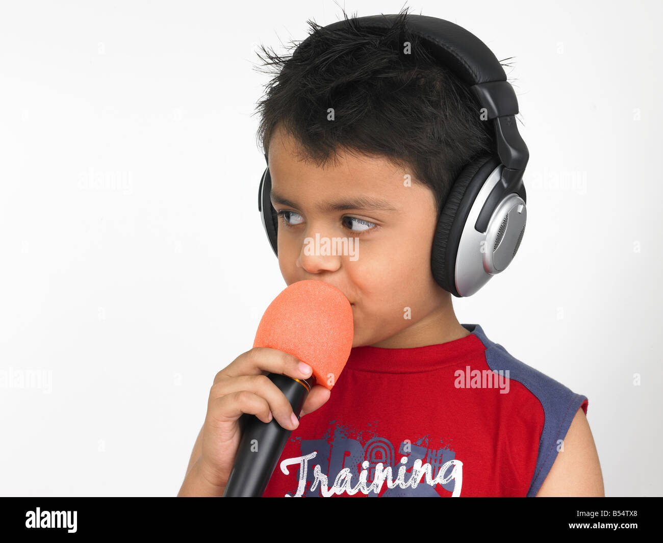 Asian boy of indian origin singing Stock Photo - Alamy