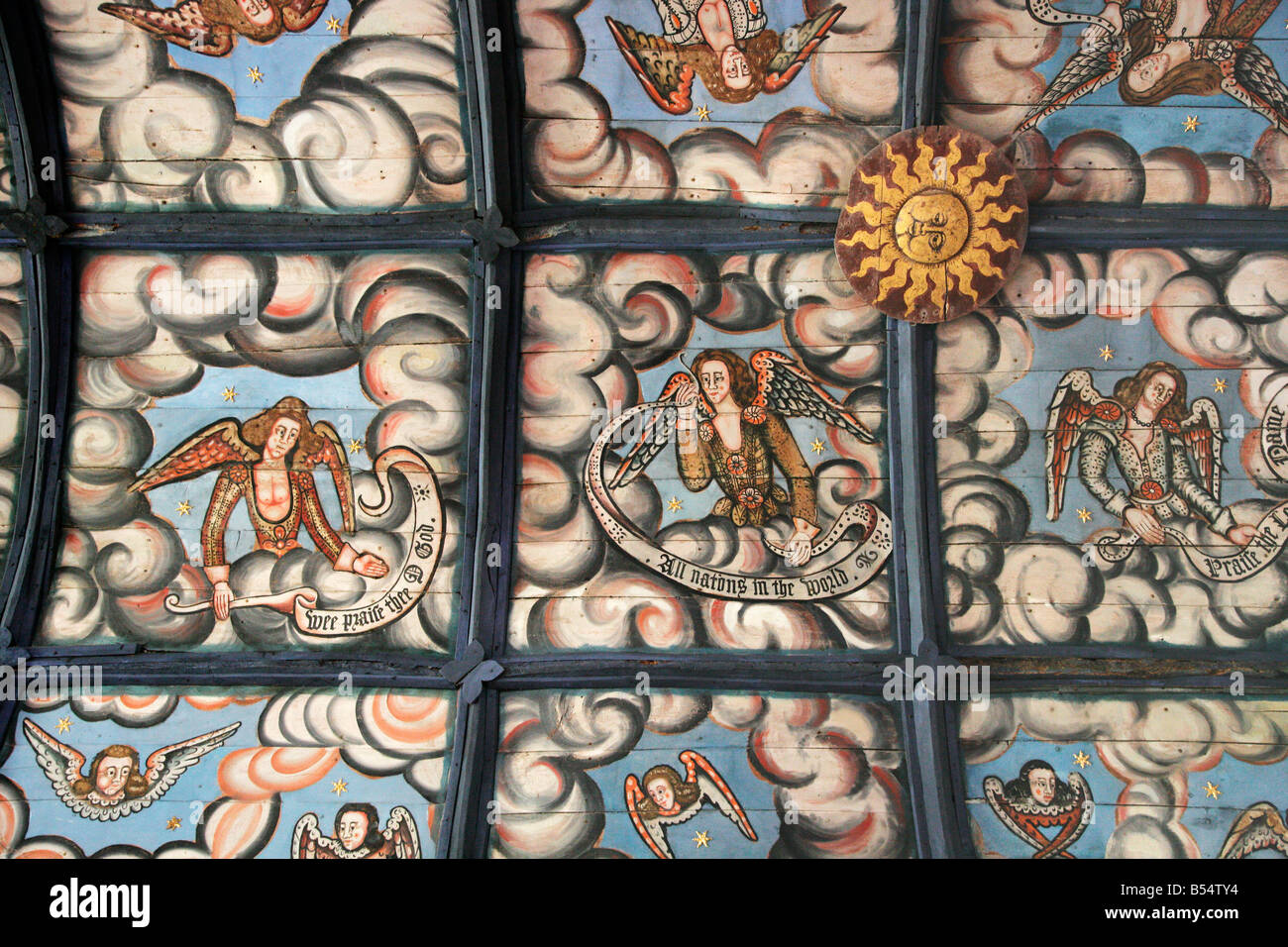 Jacobean painted ceiling showing clouds angels and the sun in St Peter ...
