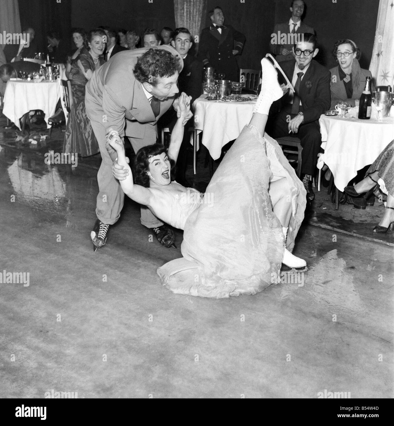 Frankie Howard tries skating with Jane Conlon, of Earls Court, who is a ...