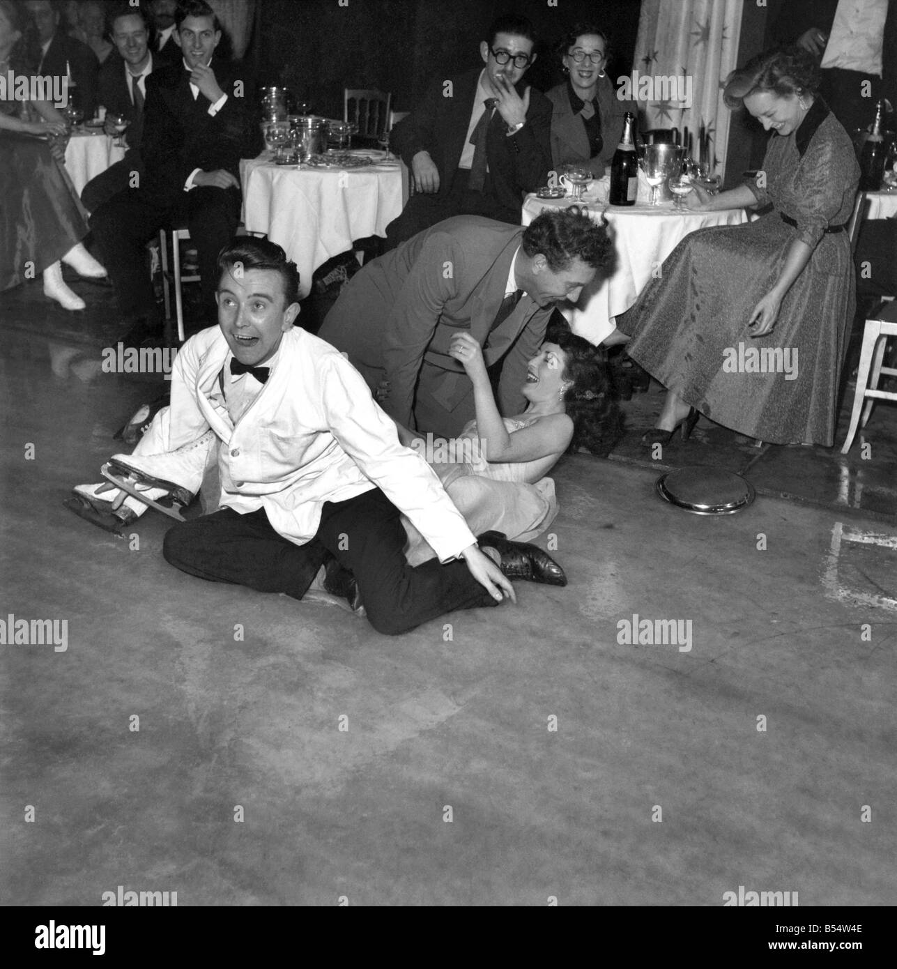Frankie Howard tries skating with Jane Conlon, of Earls Court, who is a ...