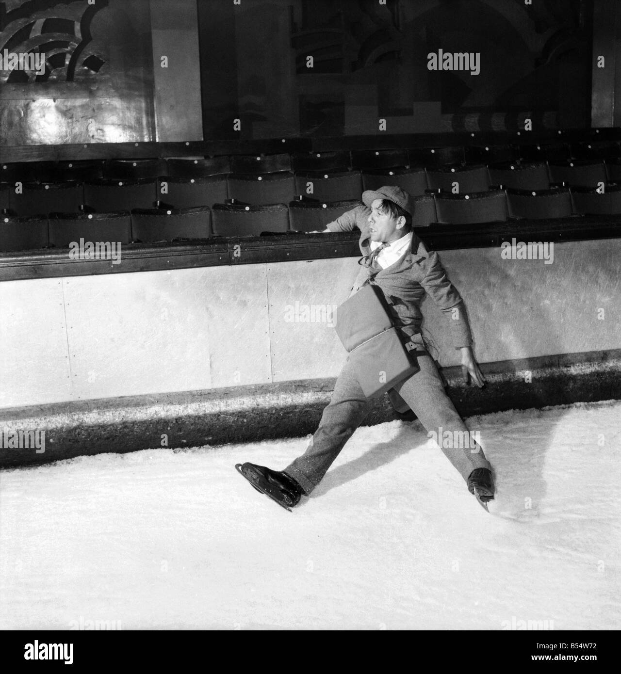 Comedian Norman Wisdom on ice. October 1953 D6365-002 Stock Photo - Alamy