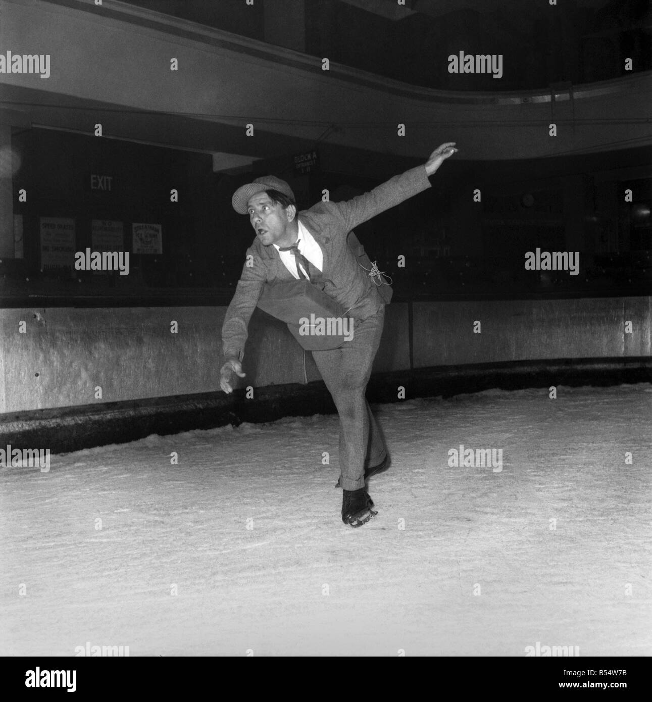 Comedian Norman Wisdom on ice. October 1953 D6365-006 Stock Photo - Alamy